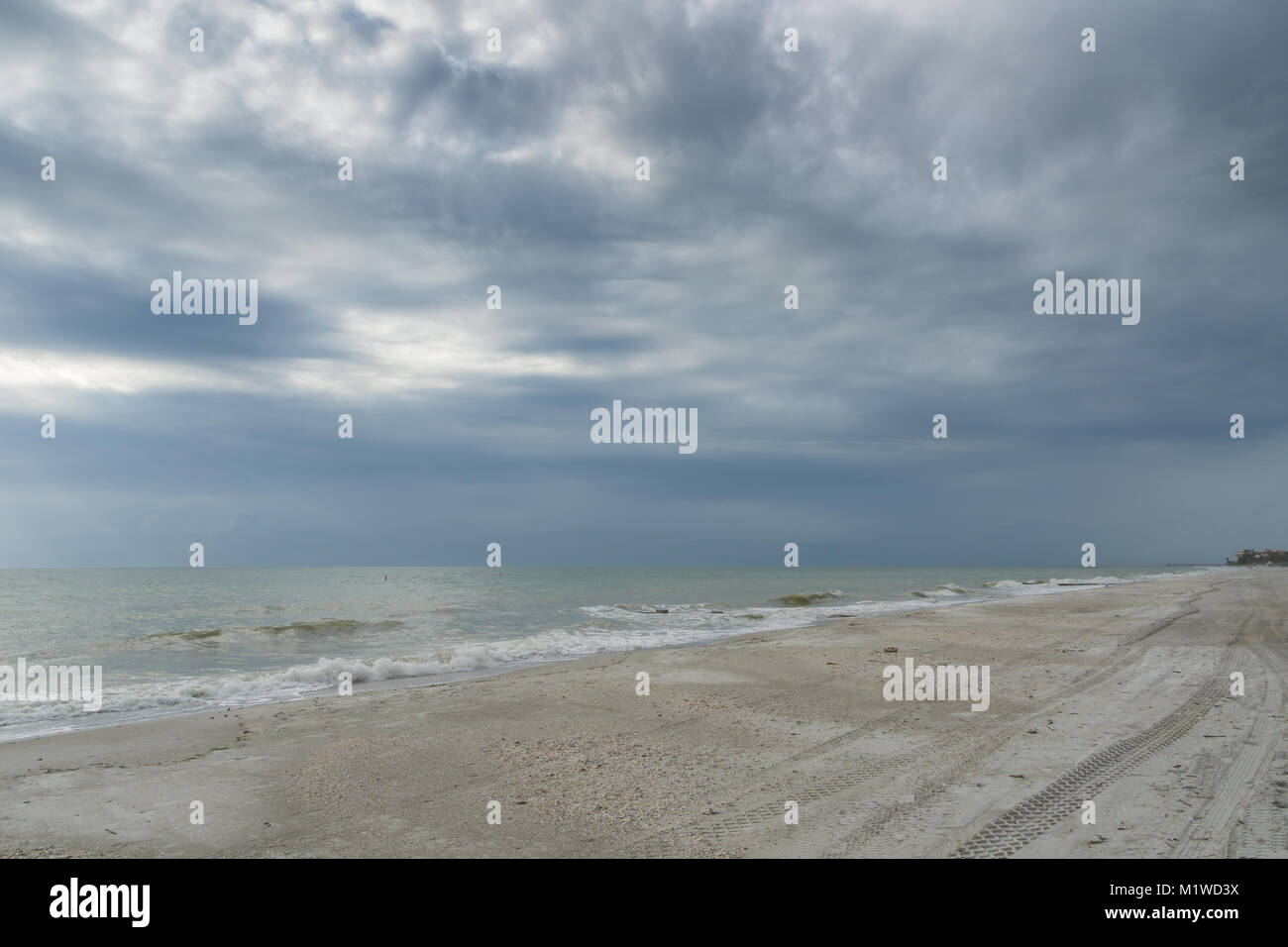 USA, Florida, Endless rough empty white sand beach with cloudy sky near ...