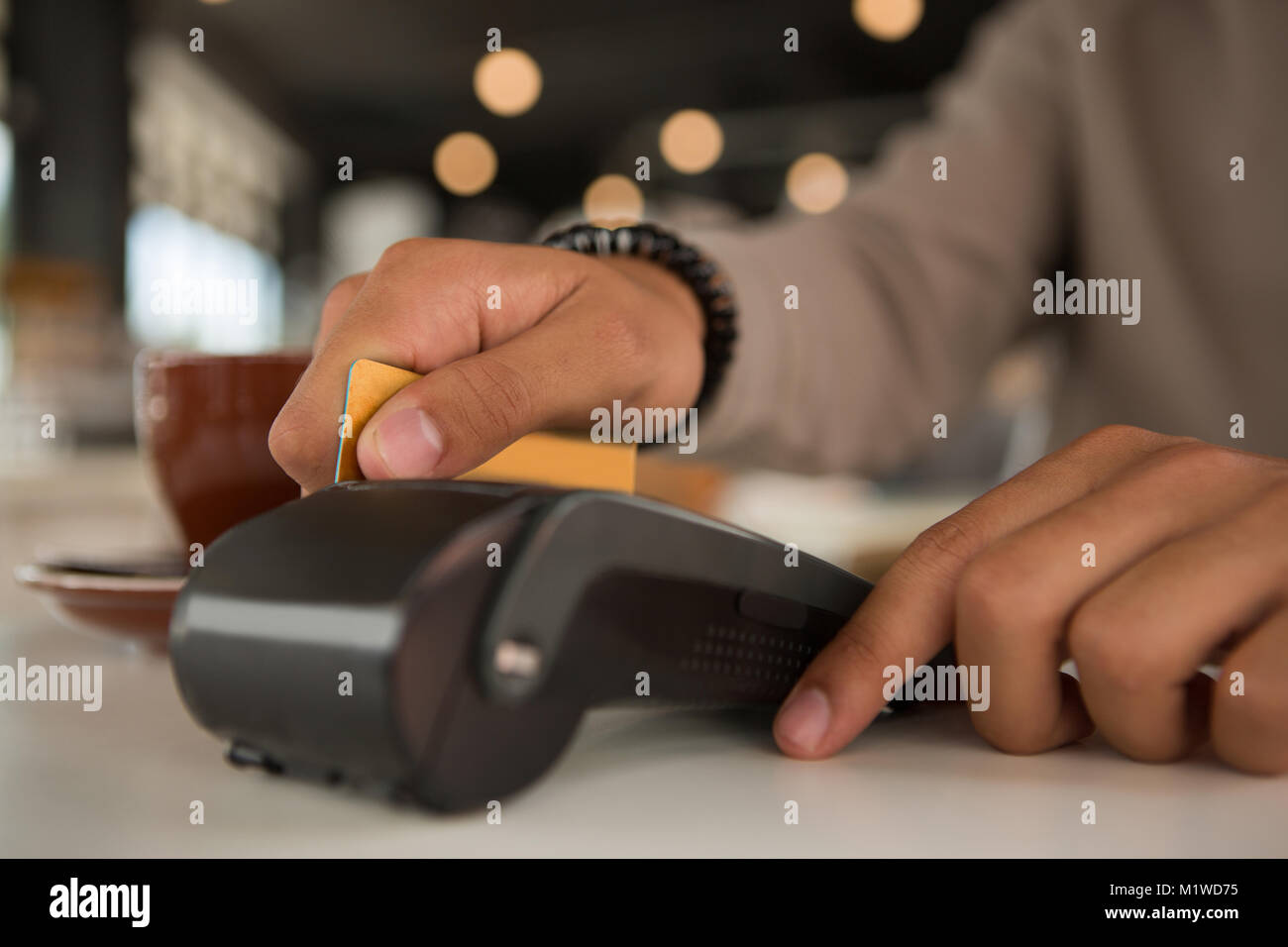 Man making payment through debit card Stock Photo - Alamy Man making payment through debit card Stock Photo - Alamy