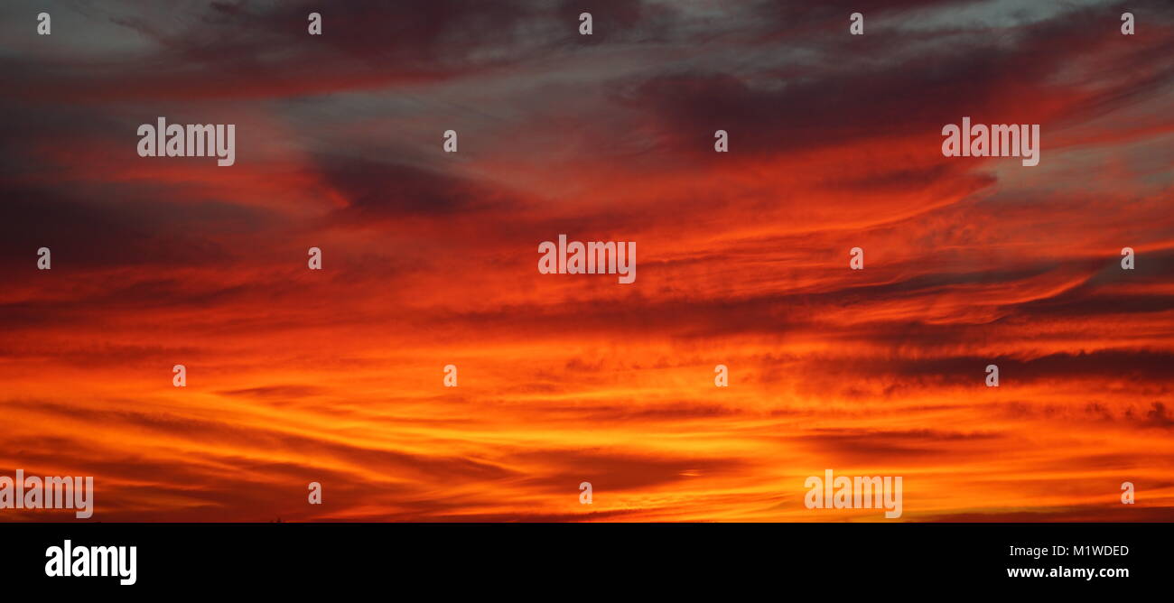 Dramatic colorful orange color sky with clouds in the evening during ...
