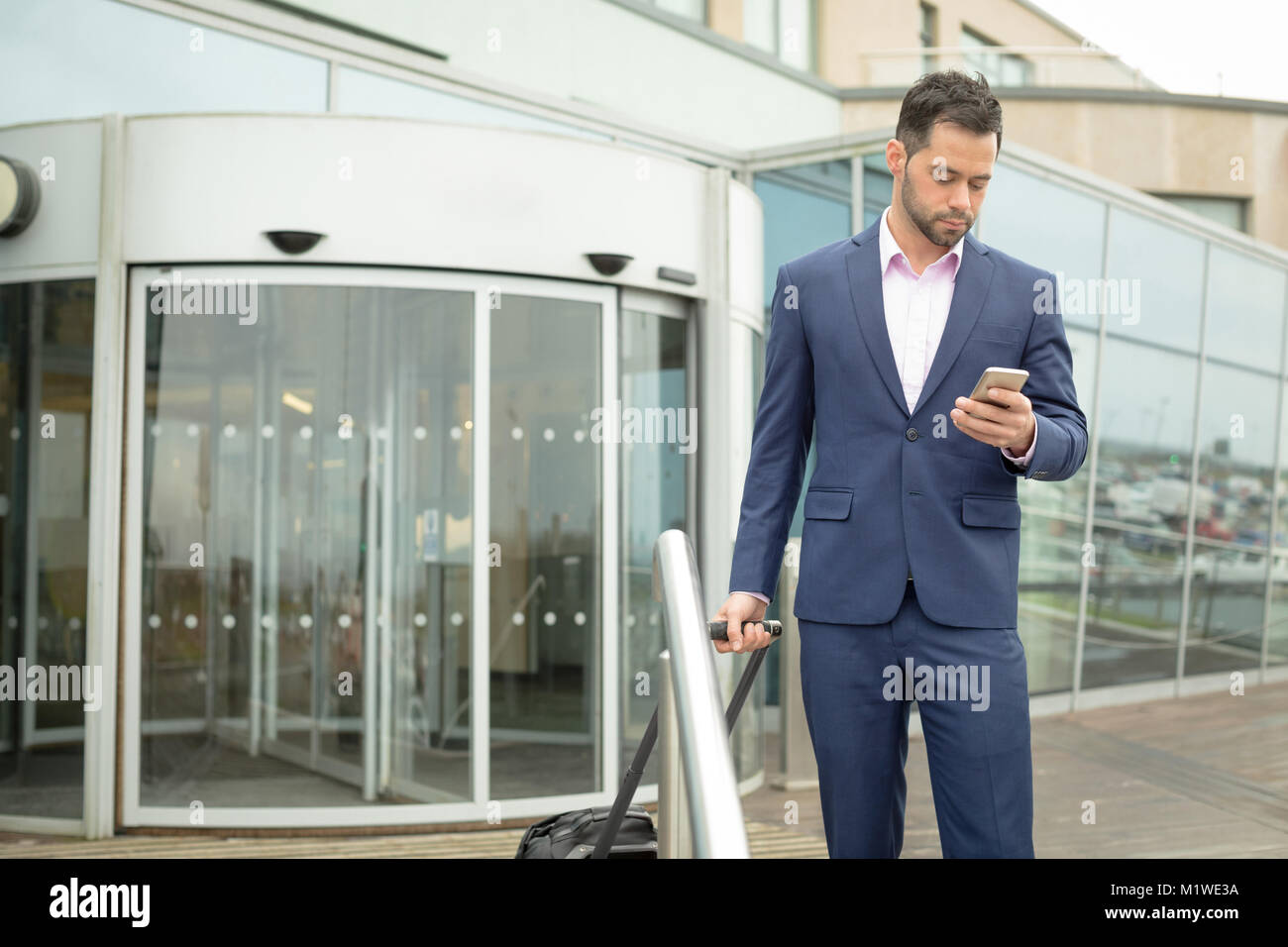 Businessman using mobile phone Stock Photo - Alamy
