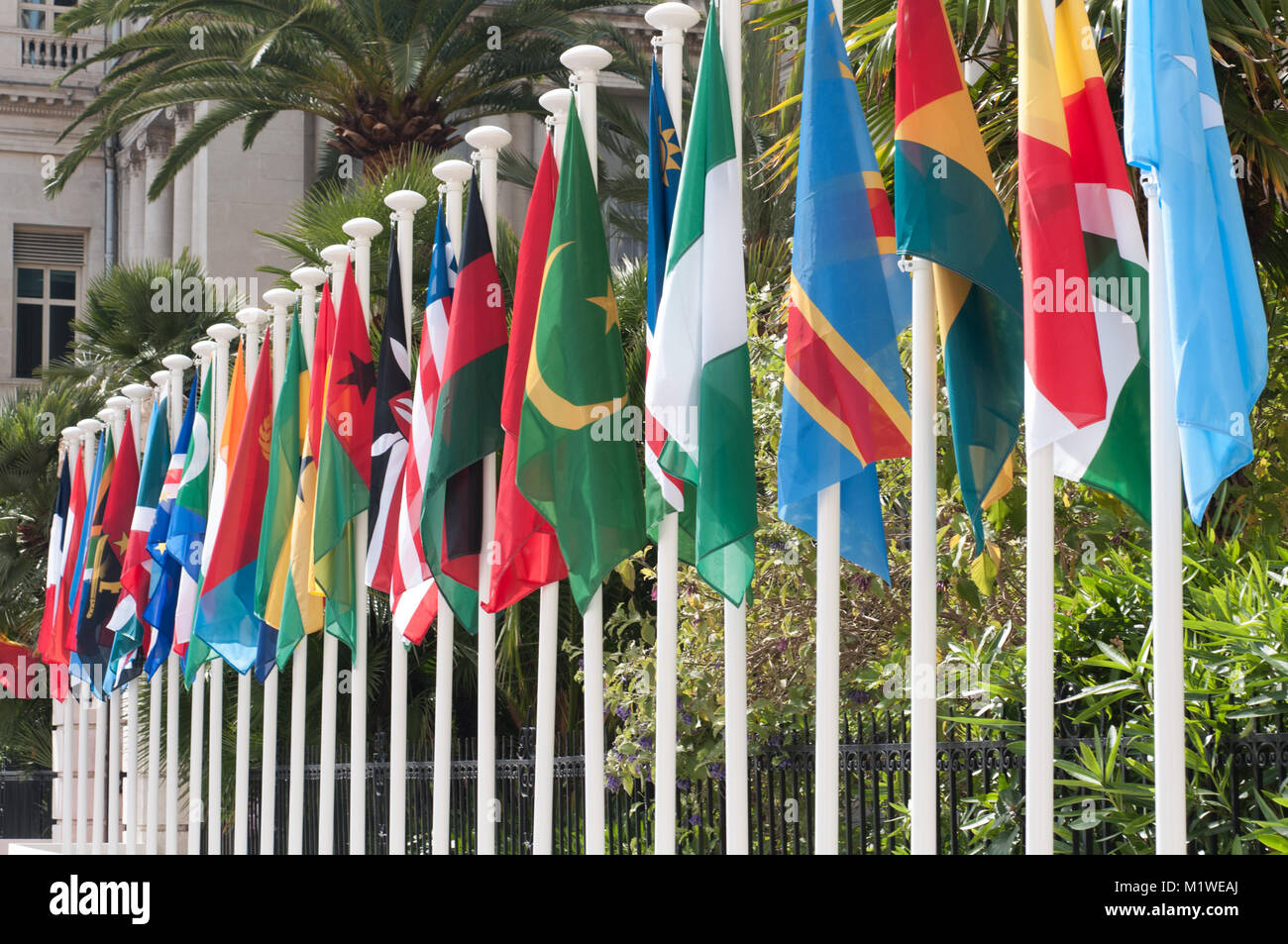 International flags in front of institutional building Stock Photo - Alamy