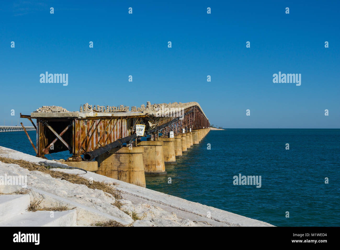 USA, Florida, Rusty ancient railroad bridge over the ocean on the ...