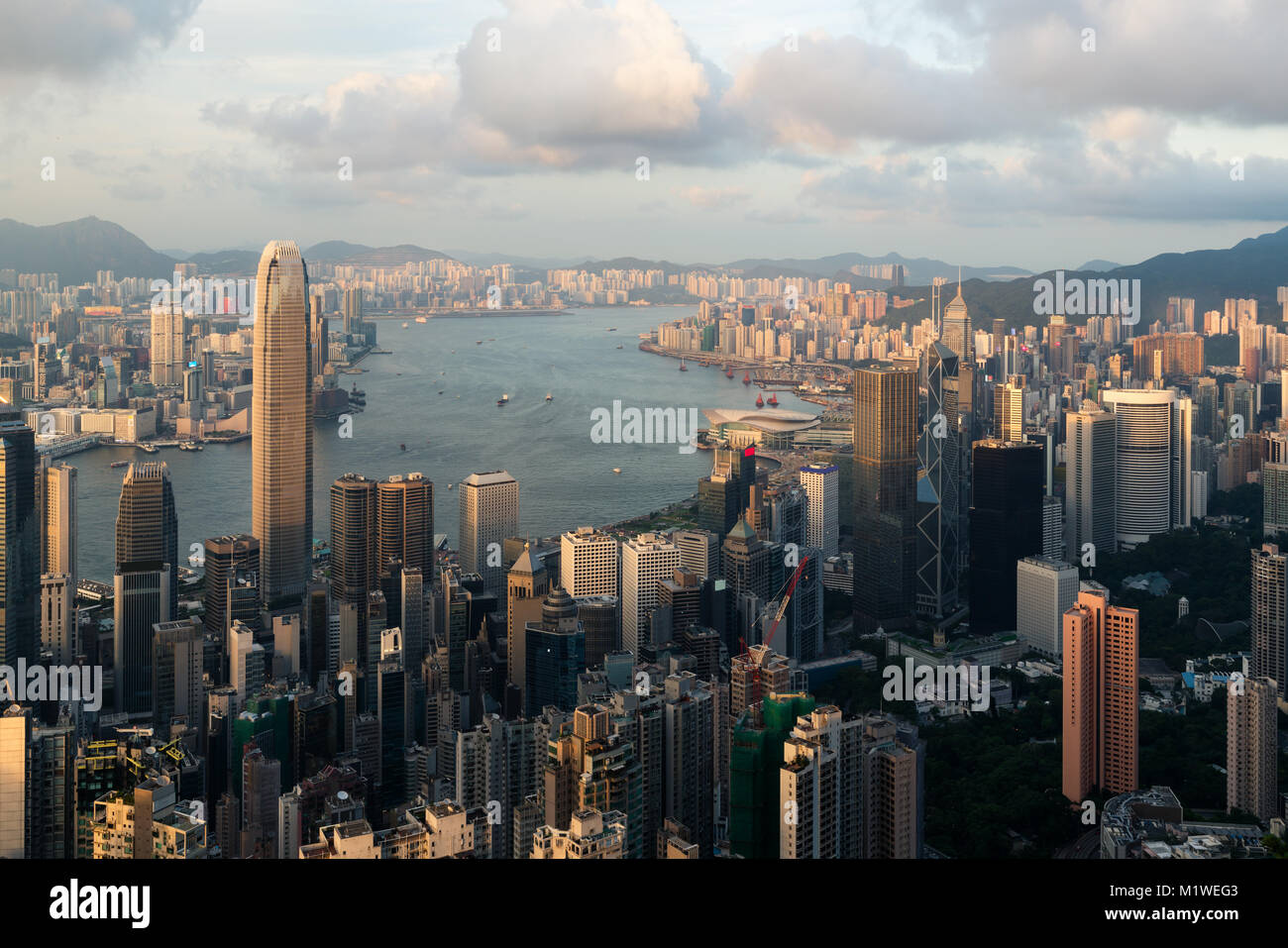 Aerial view of Hong Kong skyline and Victoria Harbor with blue sky in ...