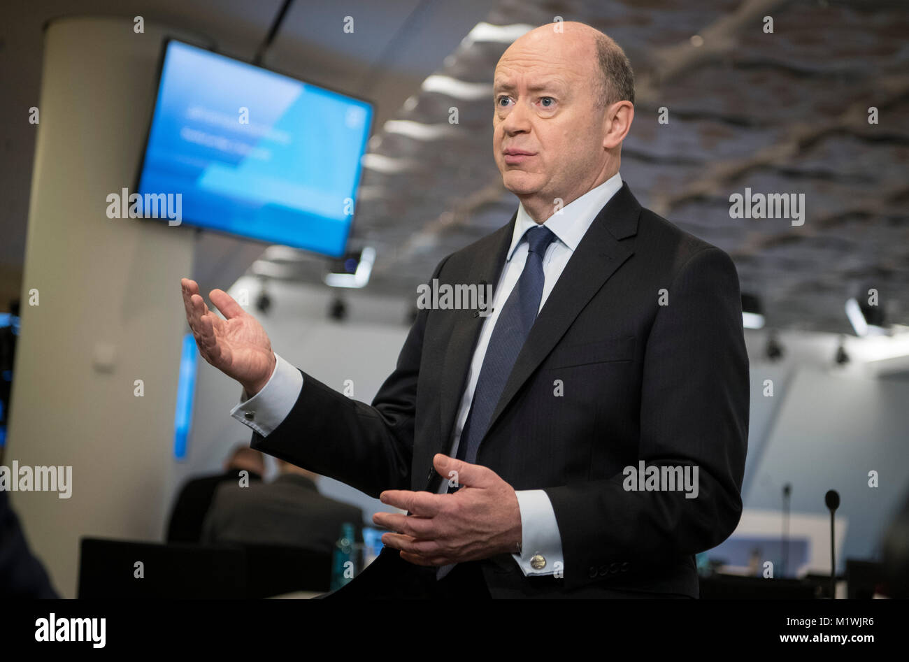 John Cryan, CEO of Deutsche Bank, gives a television interview after ...