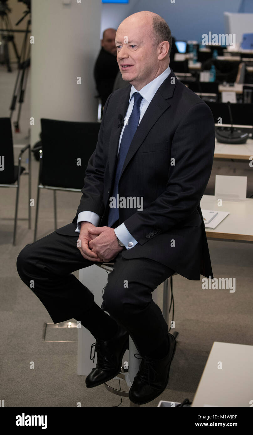 John Cryan, CEO of Deutsche Bank, gives a television interview after ...