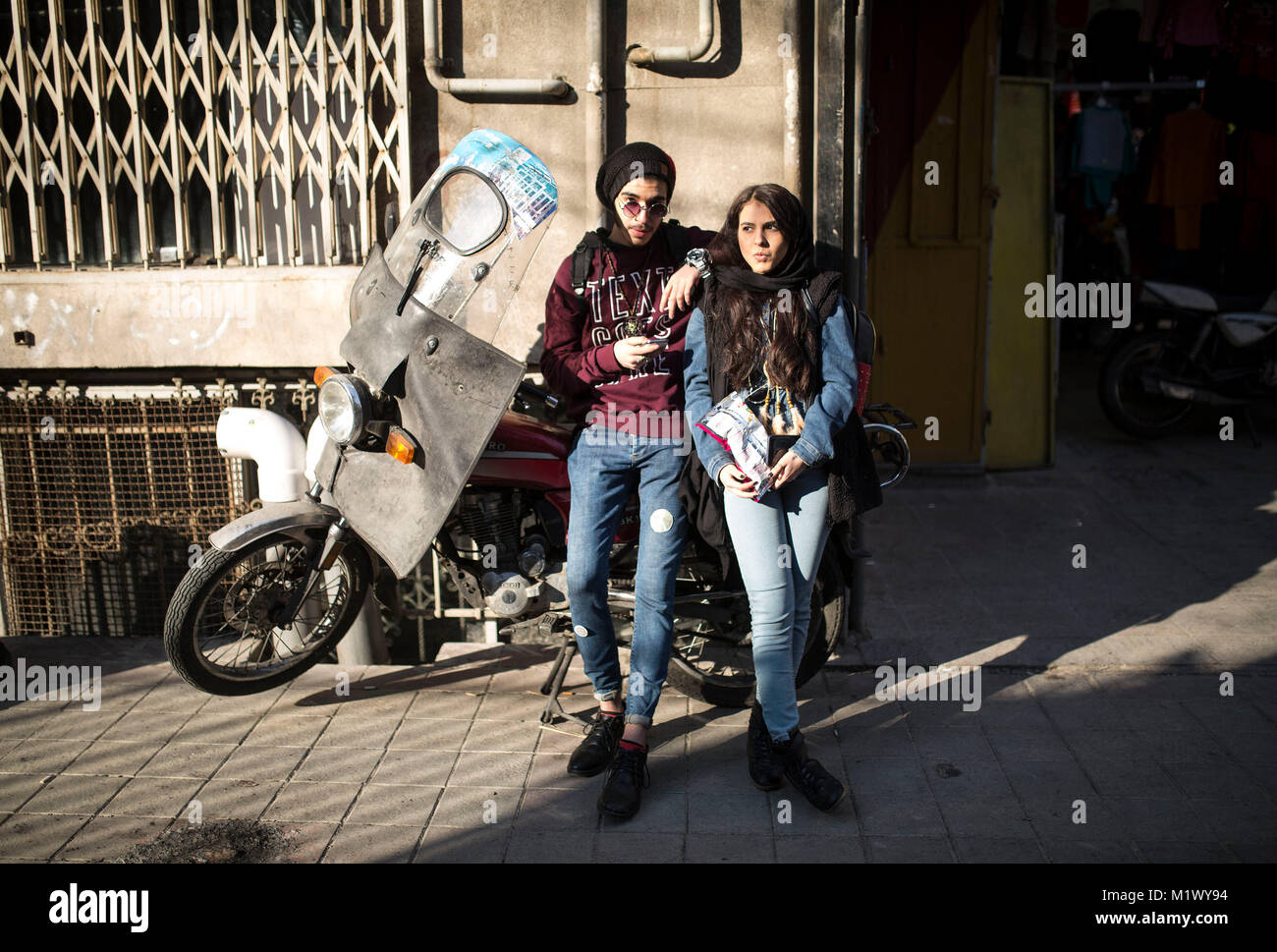 Tehran, Iran. 3rd Feb, 2018. Iranian youth spend time at an alley in ...