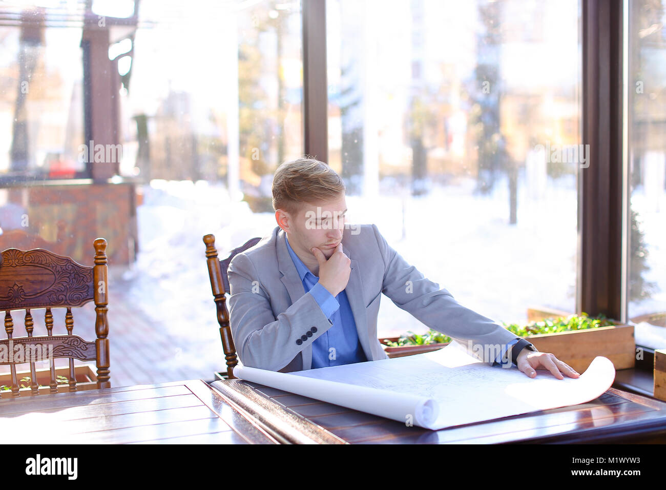 Student of architecture faculty looking at drafting work at cafe Stock ...