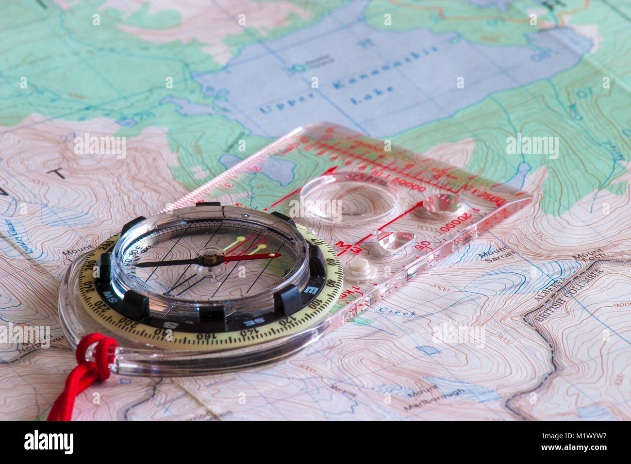 Compass on top of a topographic map Stock Photo - Alamy