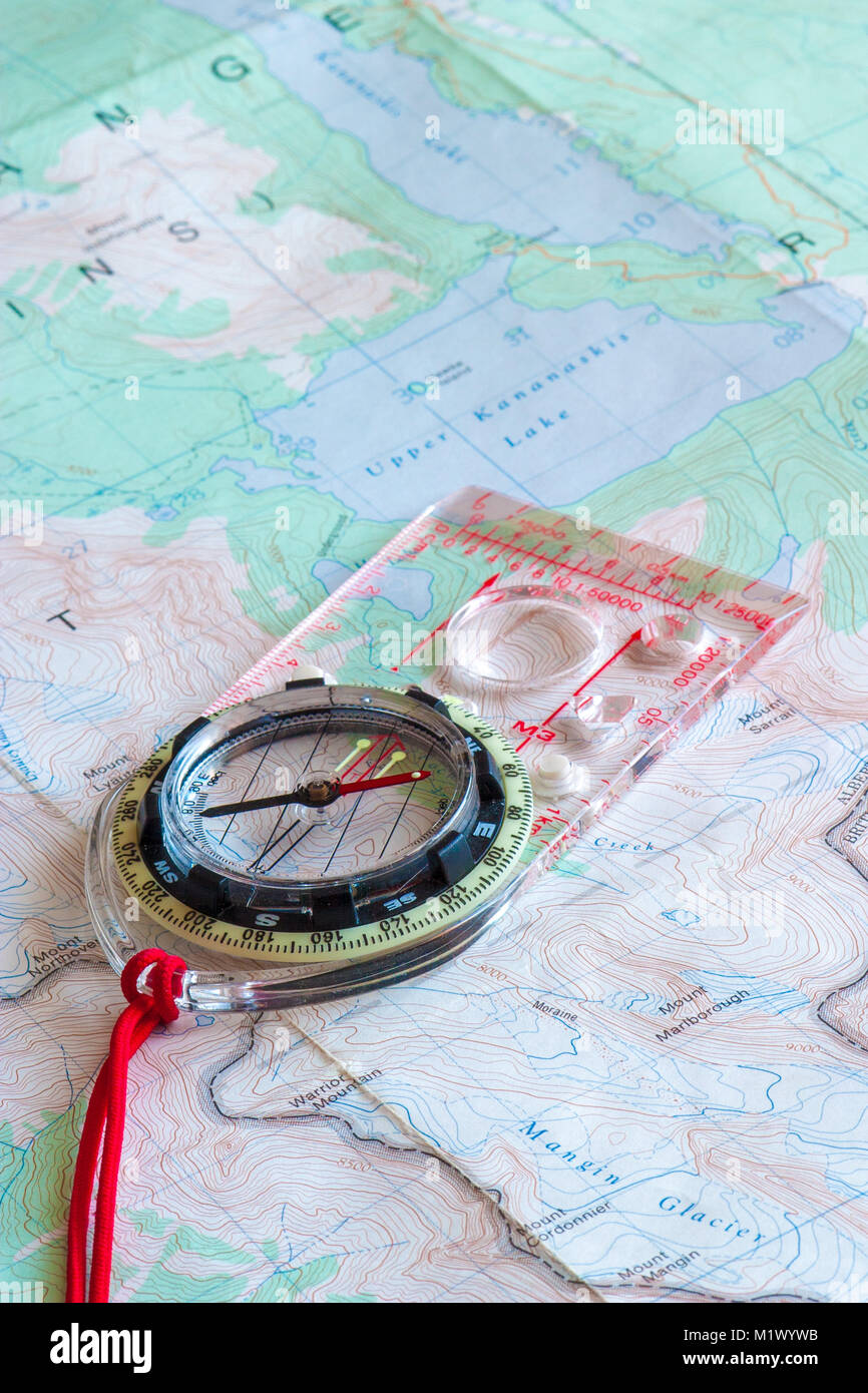 Compass on top of a topographic map Stock Photo - Alamy