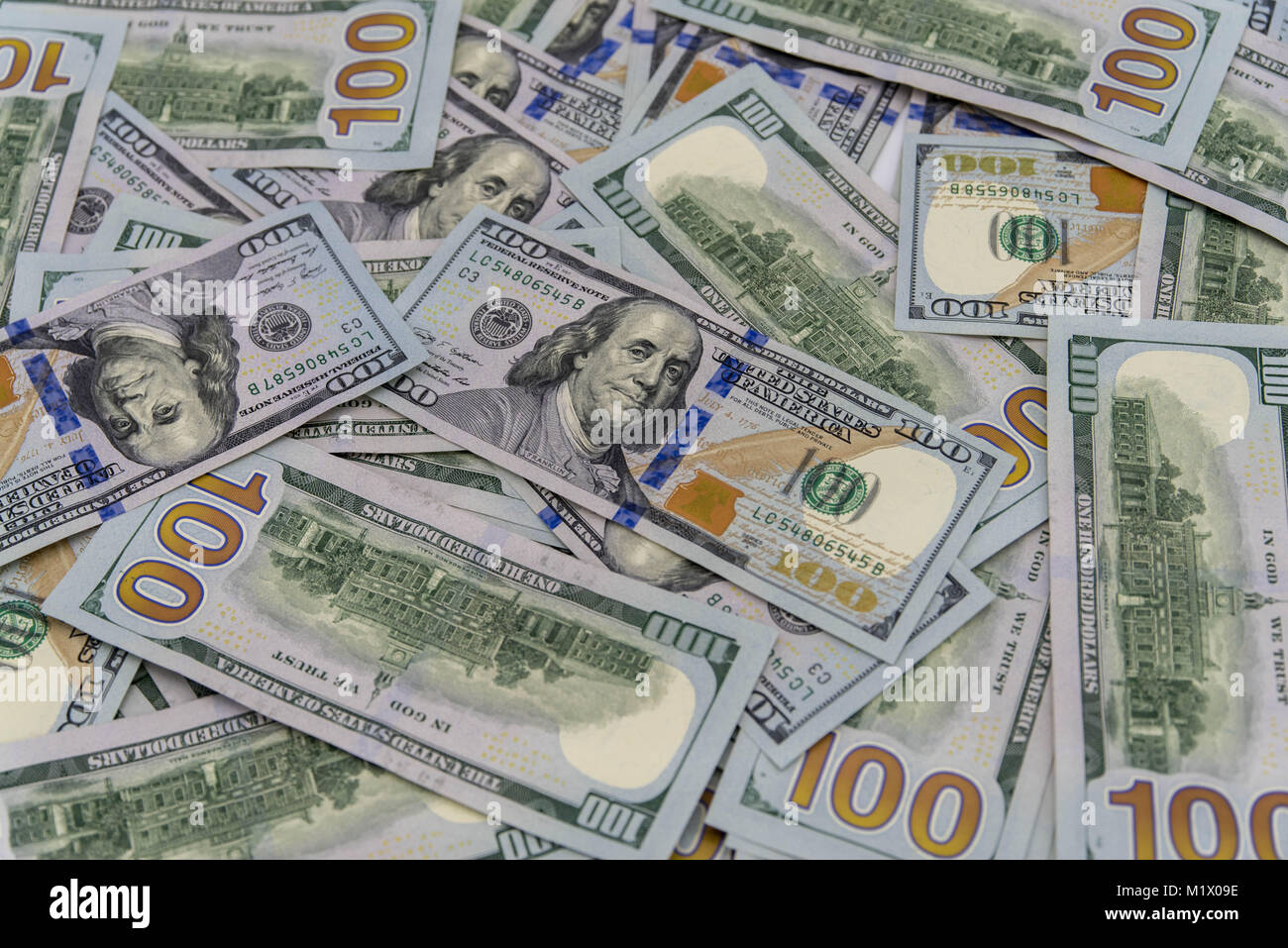 a stack of us 100 dollars cash with white background Stock Photo - Alamy