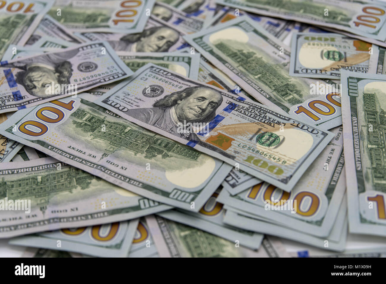 a stack of us 100 dollars cash with white background Stock Photo - Alamy
