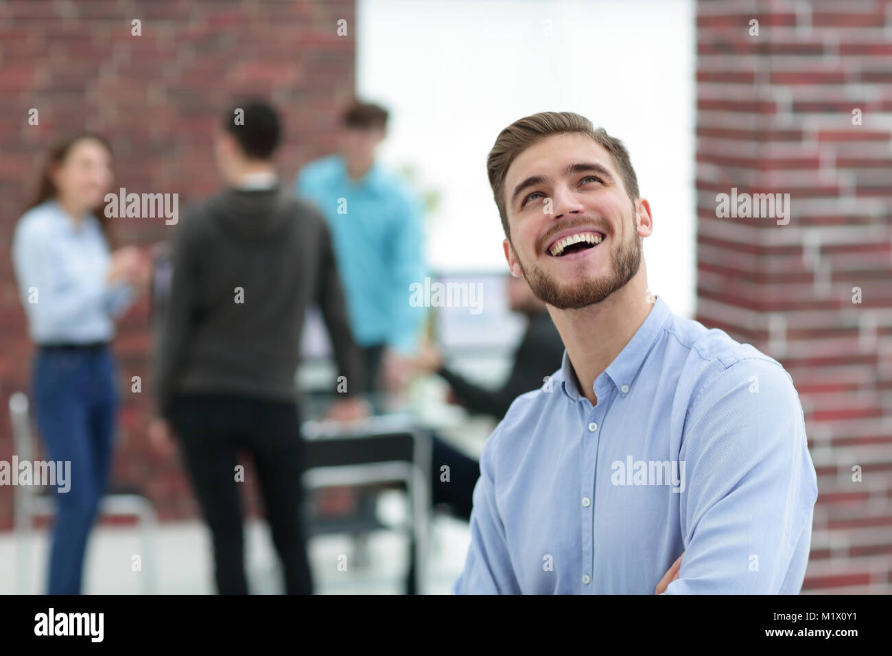 Cheerful man smiling in office Stock Photo - Alamy