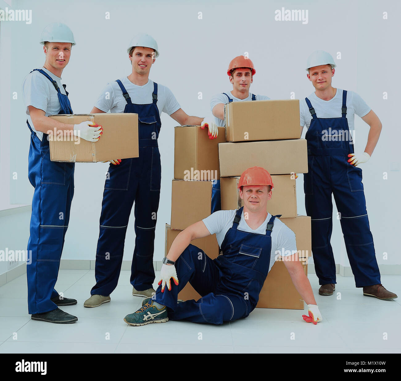 workers unload boxes Stock Photo - Alamy