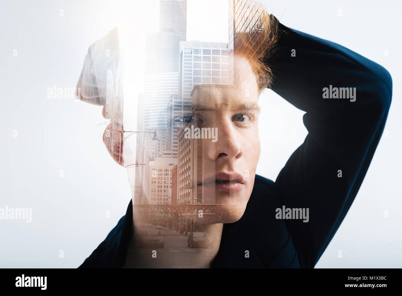 Thoughtful redhead man looking straight touching his hair Stock Photo ... Thoughtful redhead man looking straight touching his hair Stock Photo ...