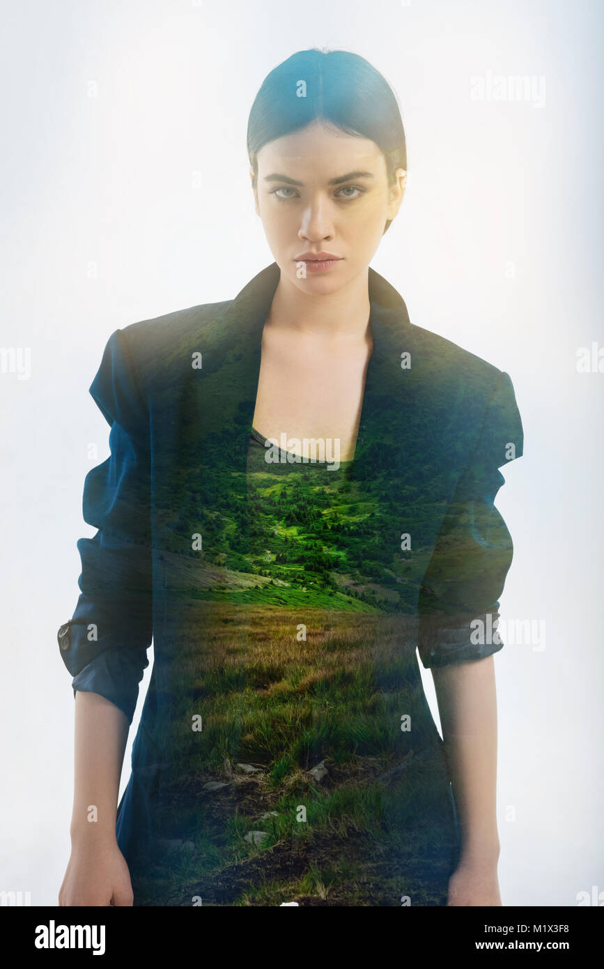 Serious colorful girl standing and looking straight Stock Photo - Alamy
