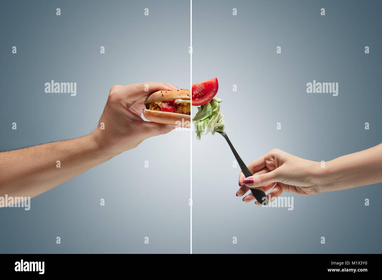 Male hand holding tasty hamburger Stock Photo - Alamy