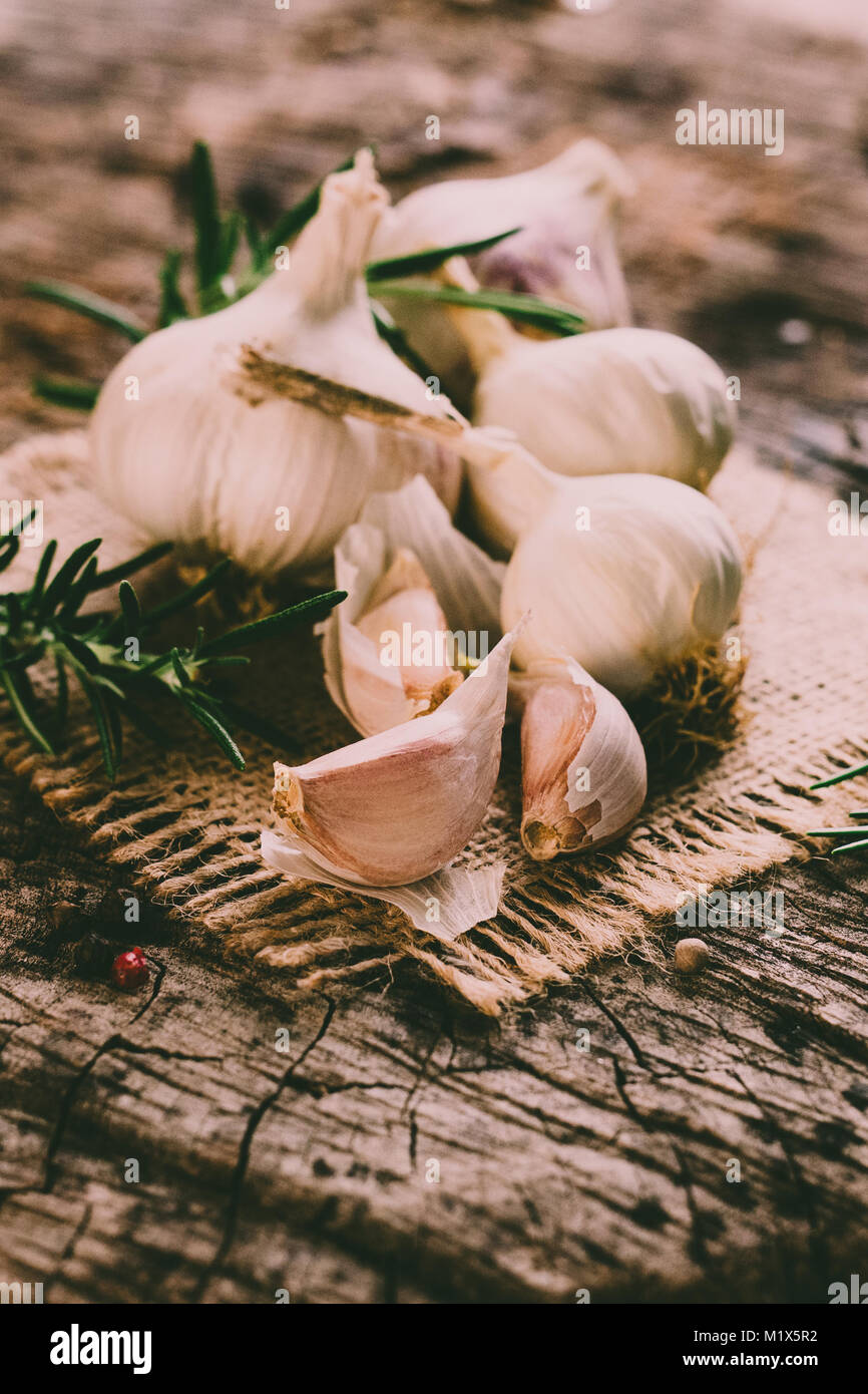 Fresh garlic on rustic background Stock Photo - Alamy