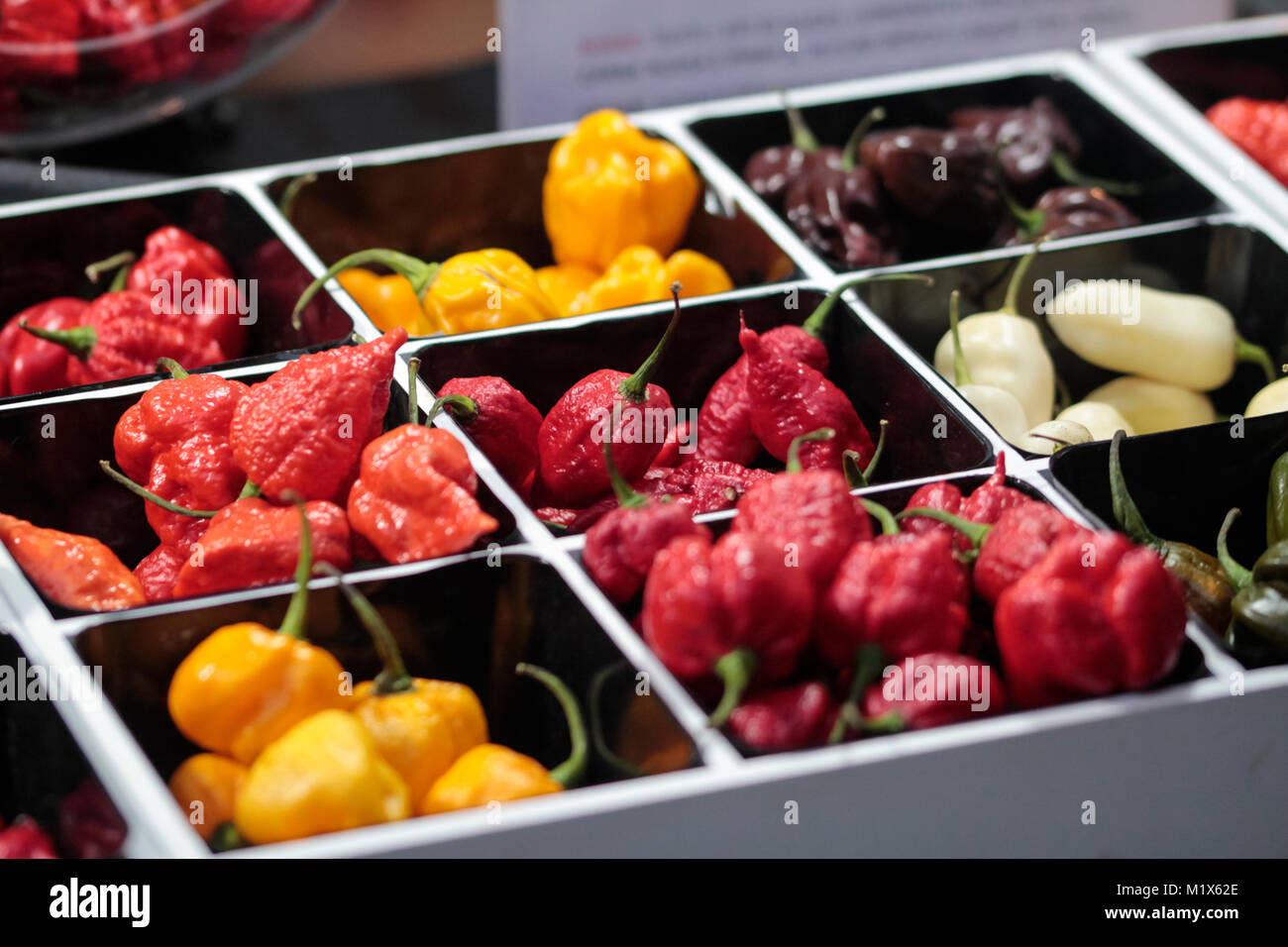 Spicy chili Peppers of various colors, sold at market Stock Photo - Alamy