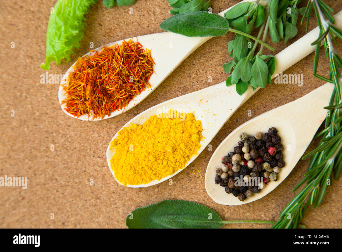 Set of spices and herbs on a corkwood Stock Photo - Alamy