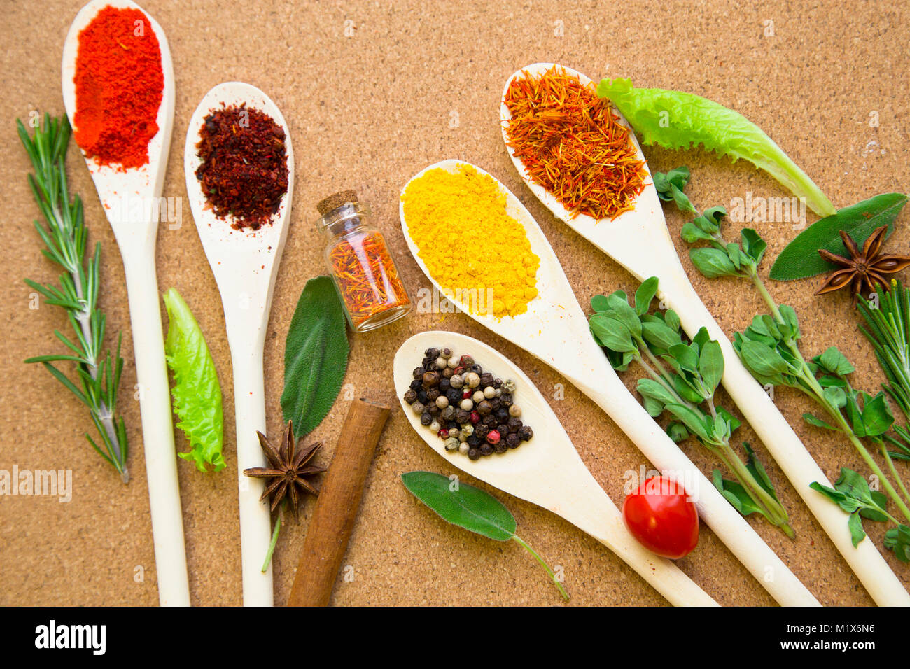 Set of spices and herbs on a corkwood Stock Photo - Alamy