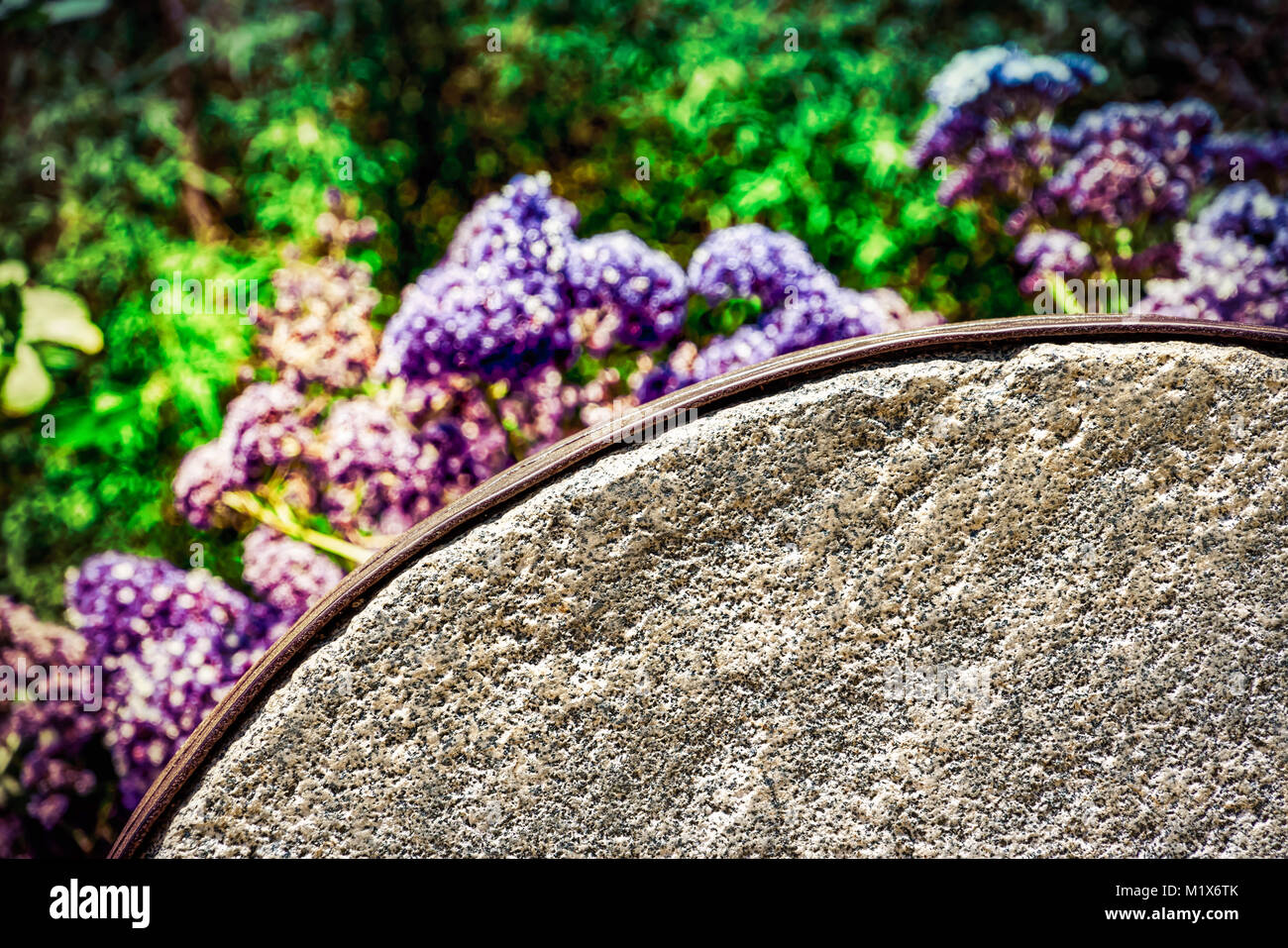 A mill stone sitting out at a southern California garden Stock Photo ...