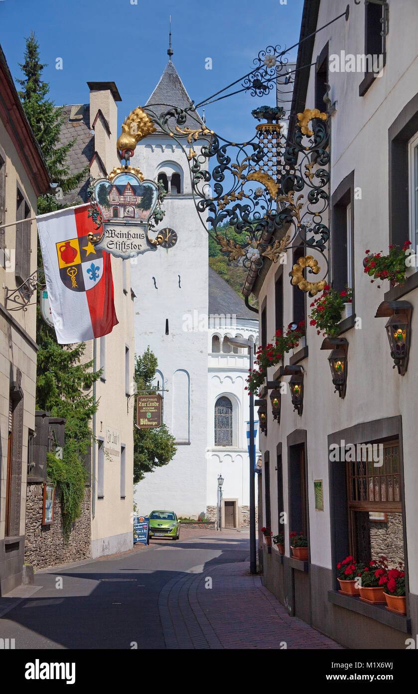 Alley with wine taverne and Saint Castor church, landmark of Treis ...