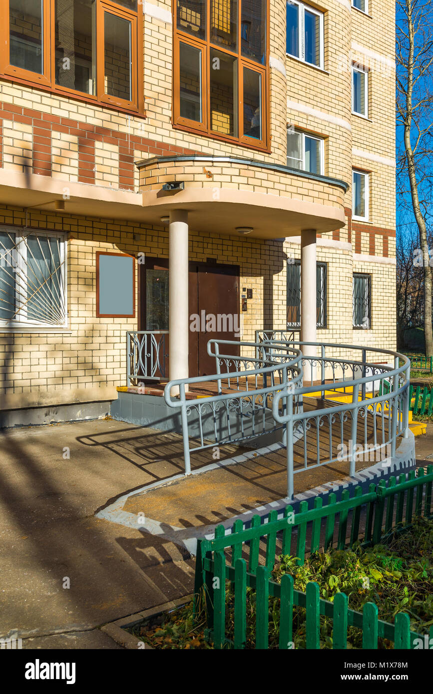 Entrance to a modern high-rise building made of bricks Stock Photo - Alamy