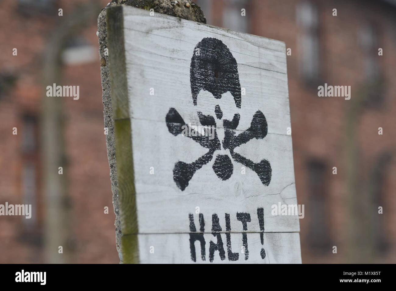 Halt! warning sign near barbed wire fences and barriers inside ...