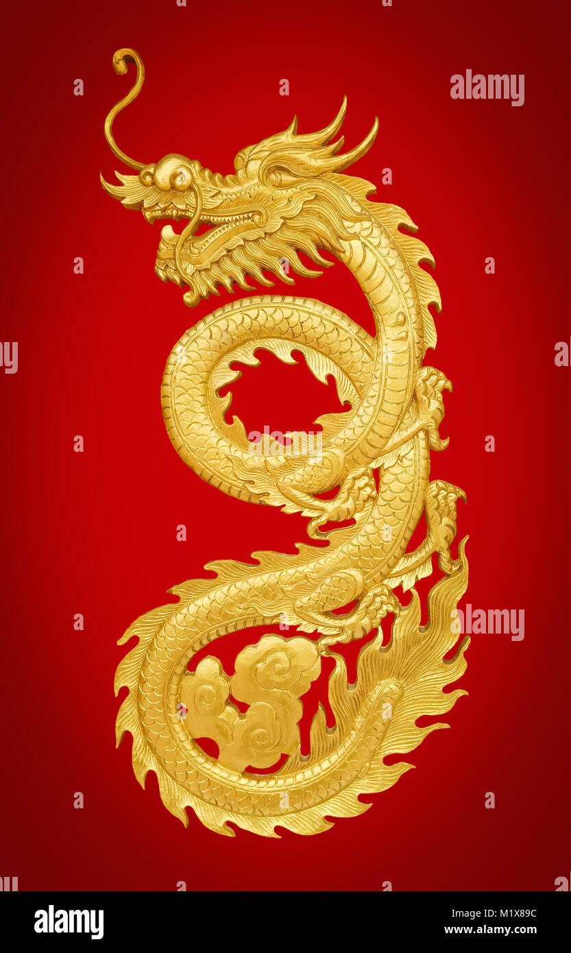 Close up golden wooden craft dragon isolated on red background Stock ...