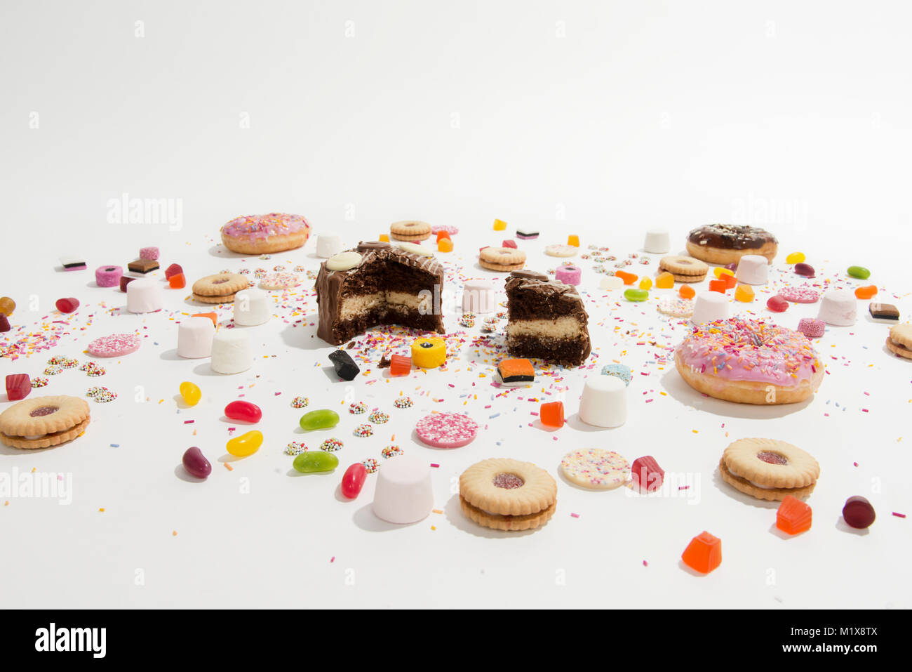 Junk food sweets white background Stock Photo - Alamy