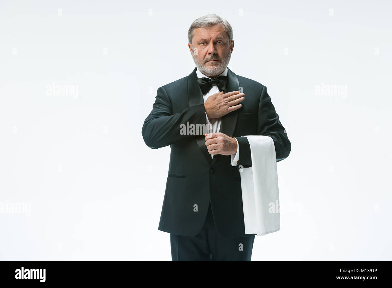 Senior waiter with white towel. Sign language in the restaurant Stock ...