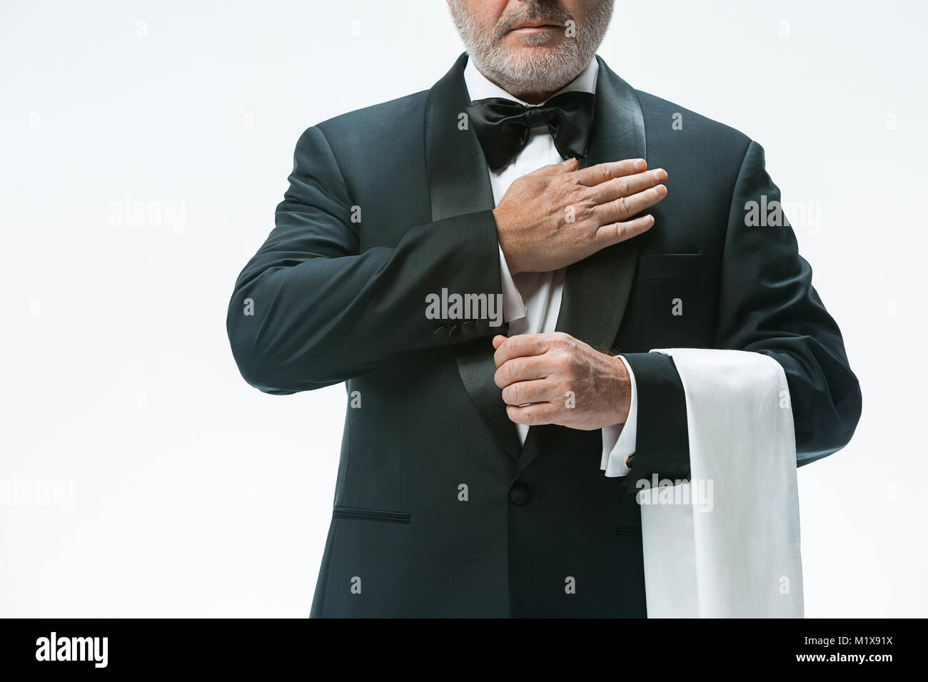 Senior waiter with white towel. Sign language in the restaurant Stock ...