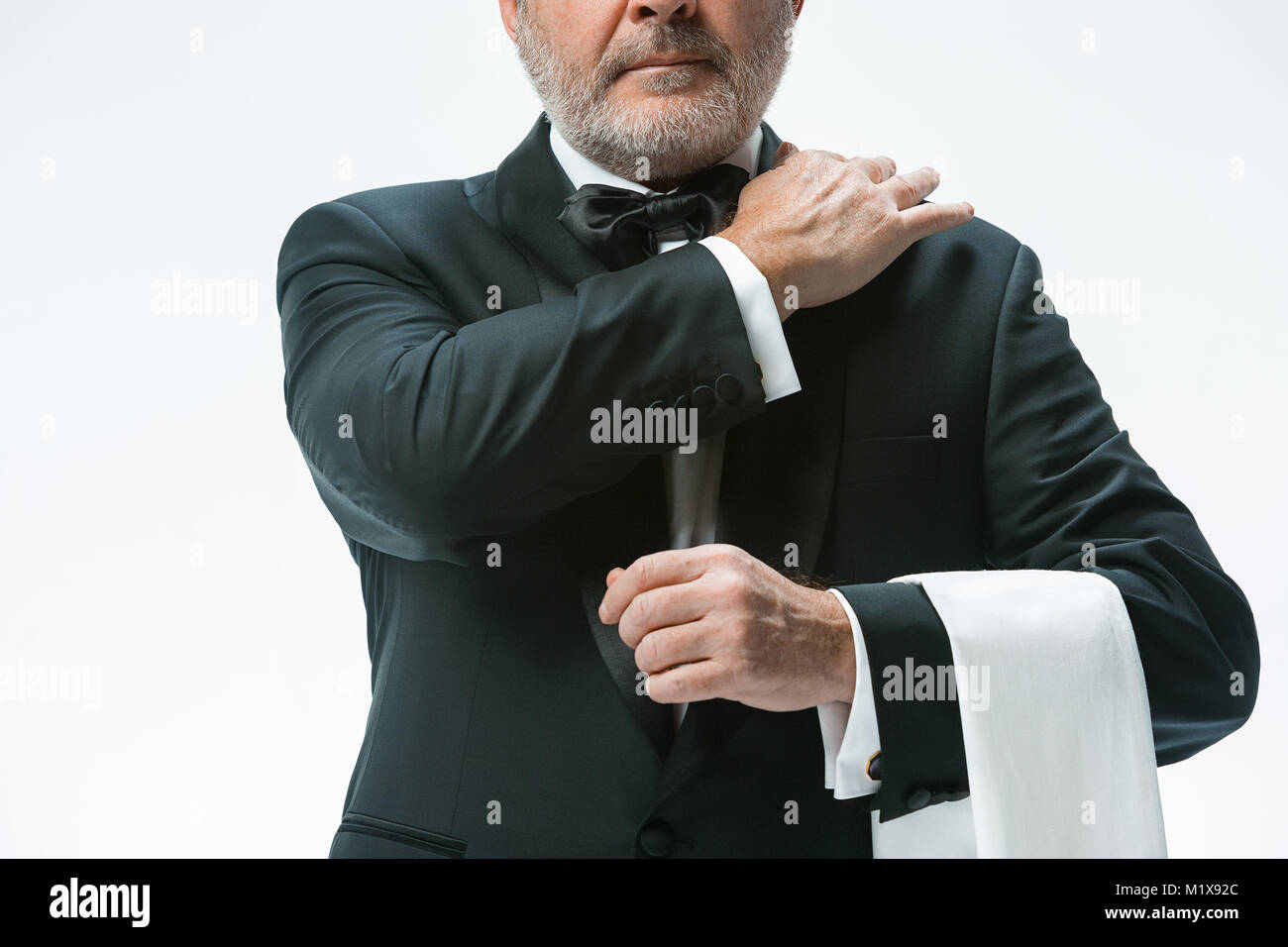 Senior waiter with white towel. Sign language in the restaurant Stock ...