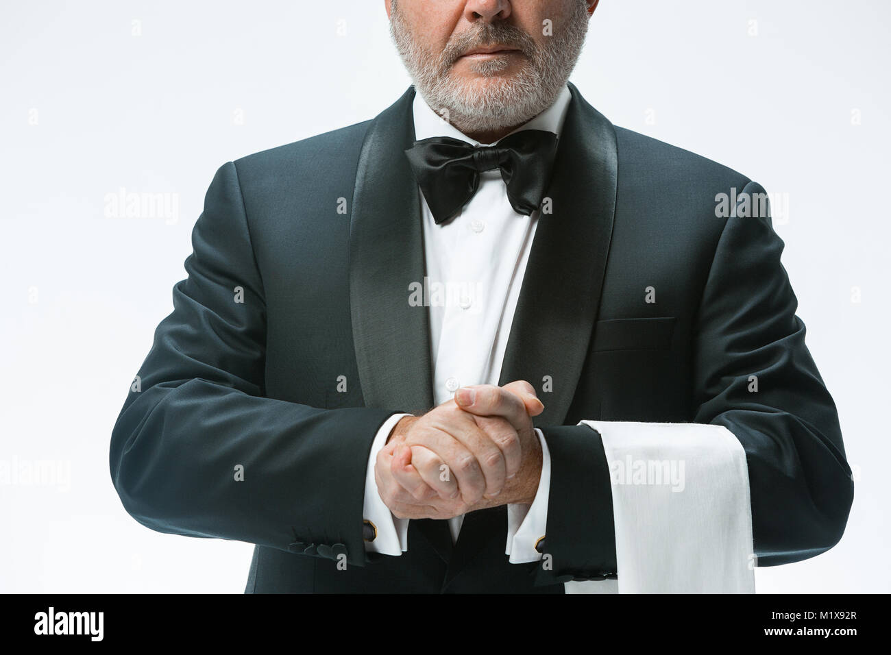 Senior waiter with white towel. Sign language in the restaurant Stock ...