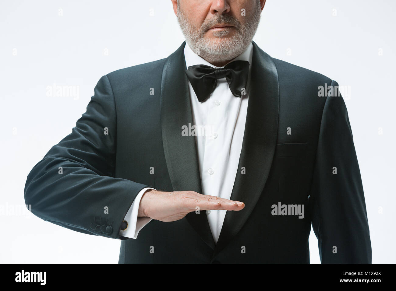 Senior waiter with white towel. Sign language in the restaurant Stock ...