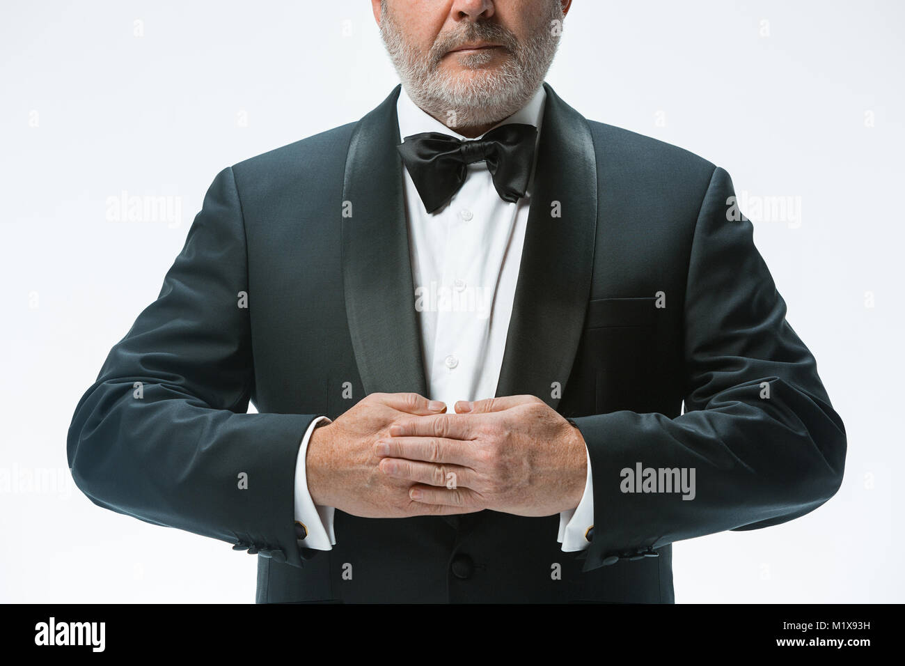 Senior waiter with white towel. Sign language in the restaurant Stock ...
