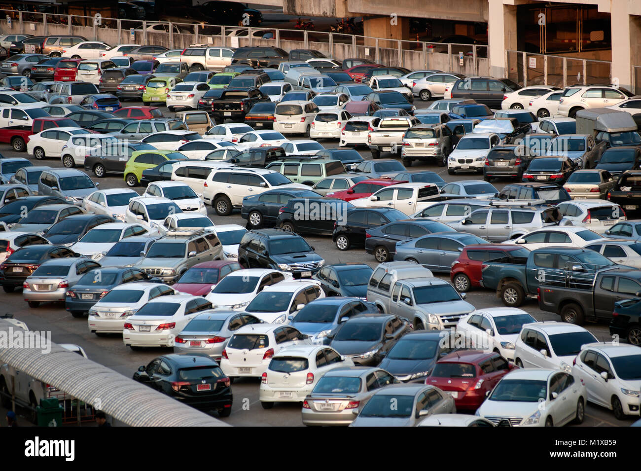 Car parked at a park and side lot at a Morchit BTS station in Chatuchak ...