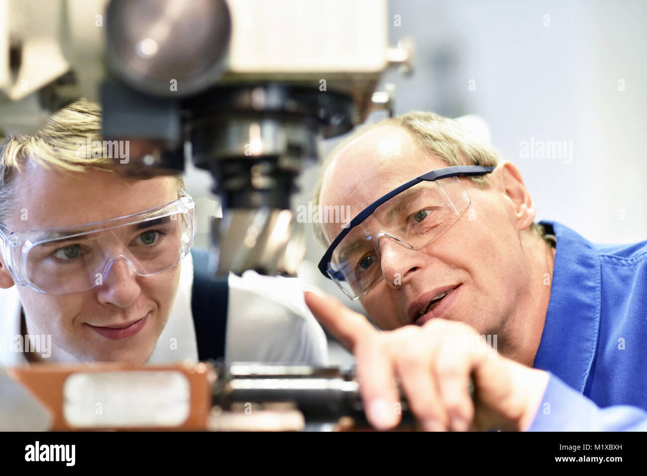 closeup picture: trainer and apprentice in vocational training on a ...