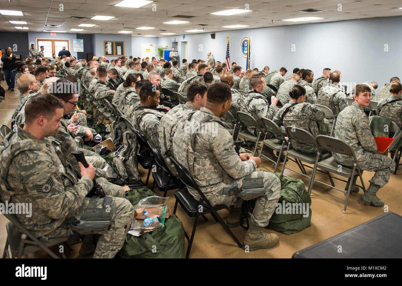 Service members from Wright-Patterson Air Force Base, Ohio, sit in a ...