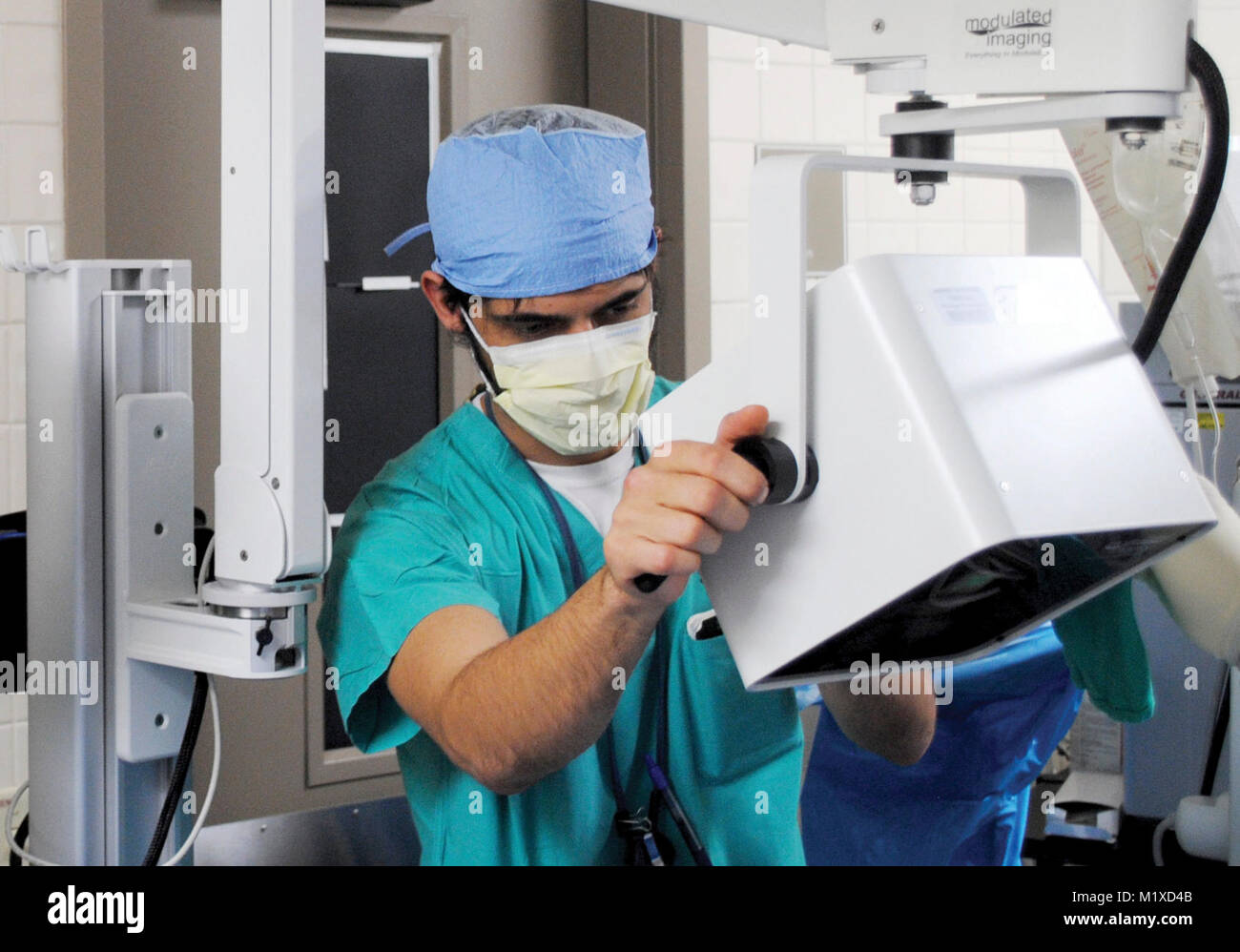 A clinician operates an SFDI unit, which is being developed and ...