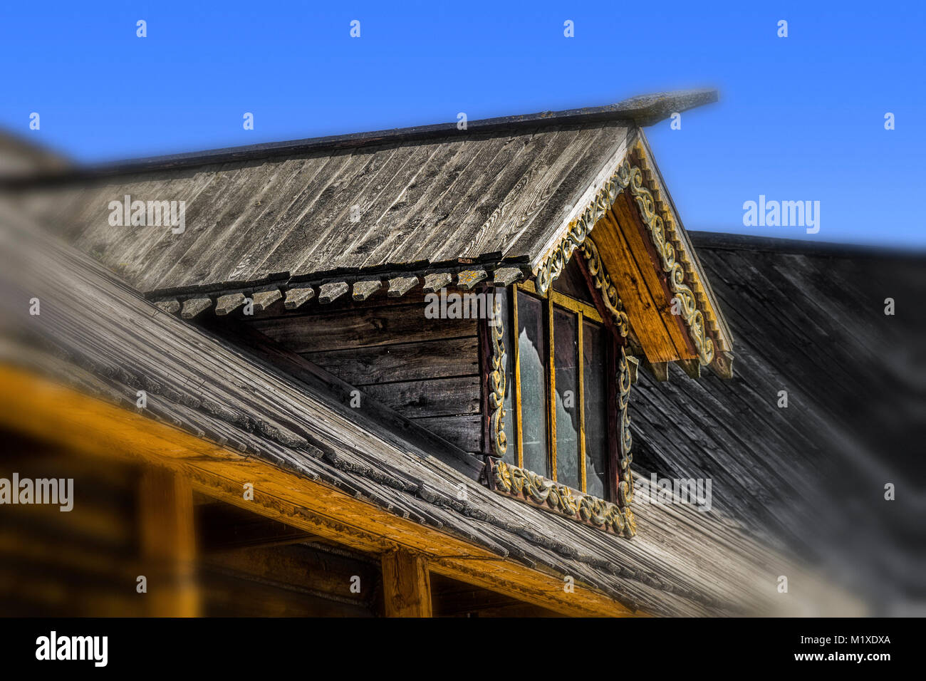 The upper attic window of the old wooden house Stock Photo - Alamy