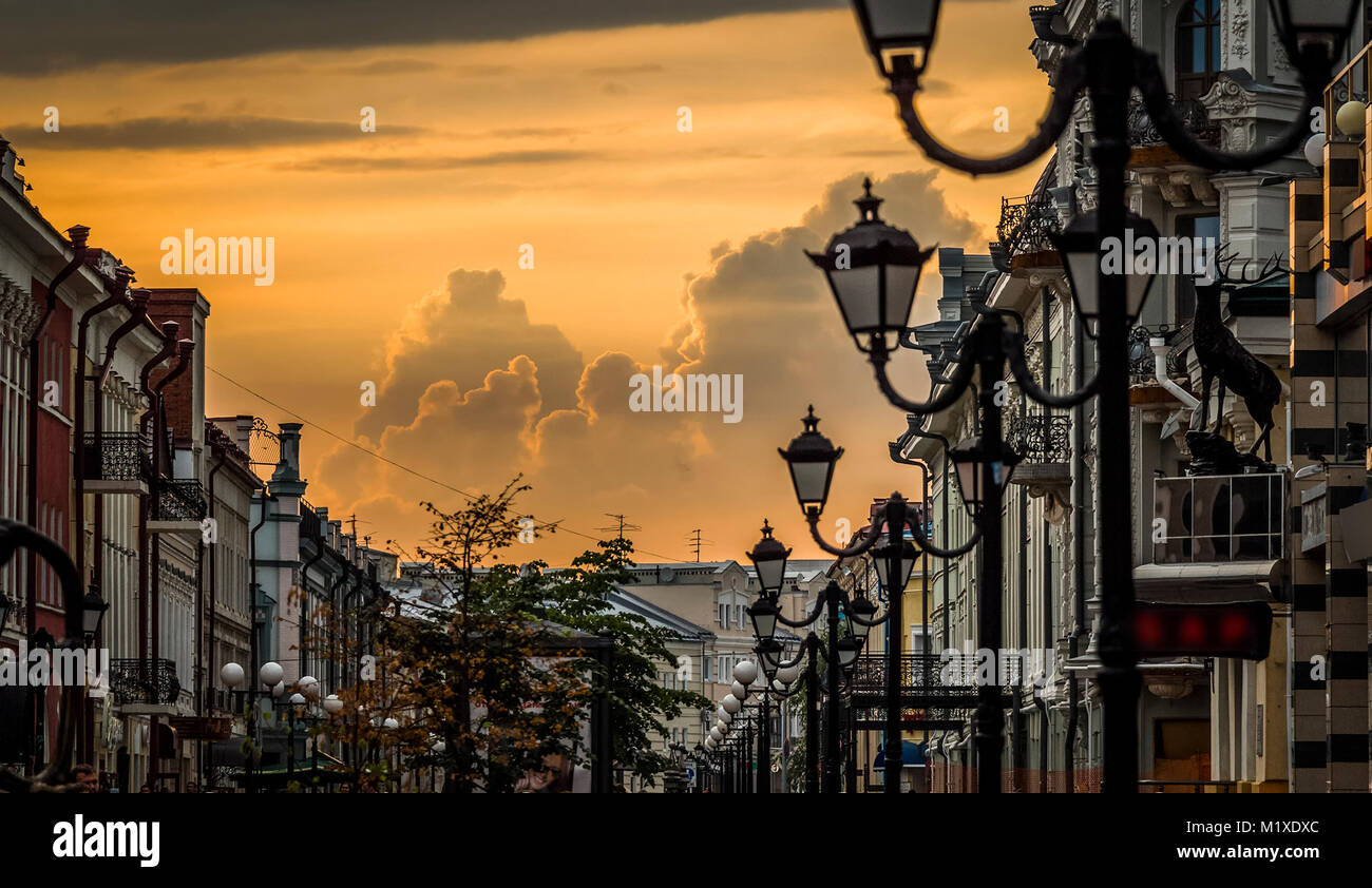Beautiful evening sky during the sunset over the street of the old city ...