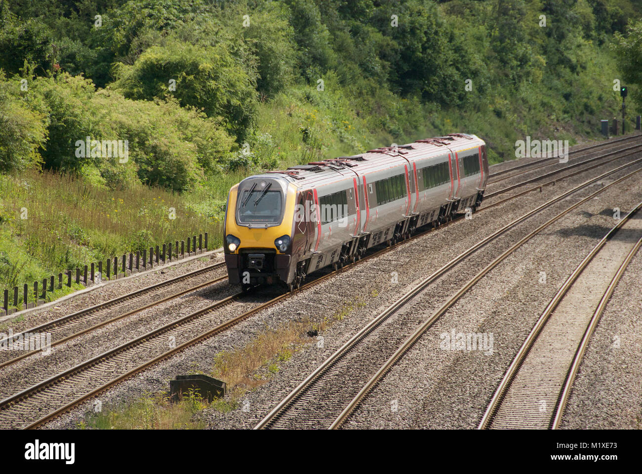 Class 220 Passenger train traveling in the countryside of Berkshire ...