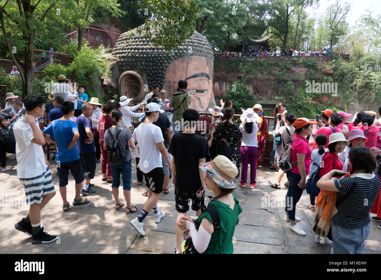 People and tourists at the Leshan Giant Buddha in Leshan, Sichuan ...