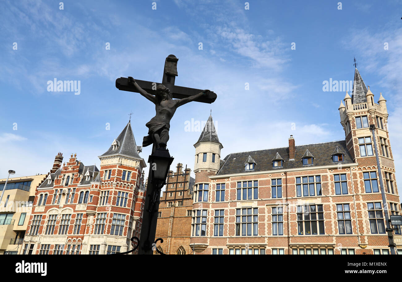 Low angle view of cross rood over old historical buildings and clear ...