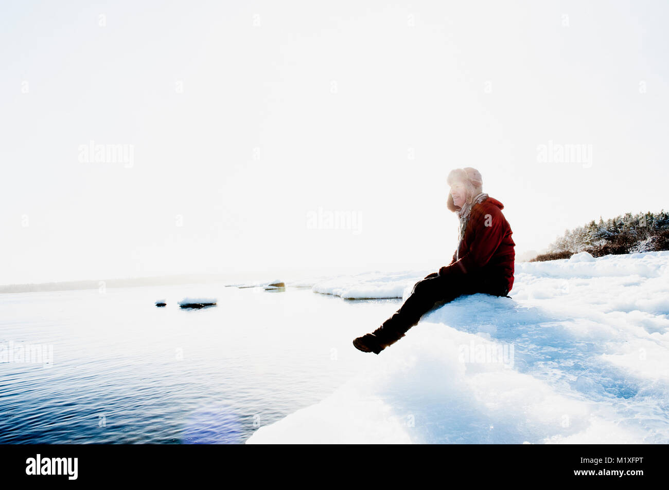 Man sitting on ice hi-res stock photography and images - Alamy