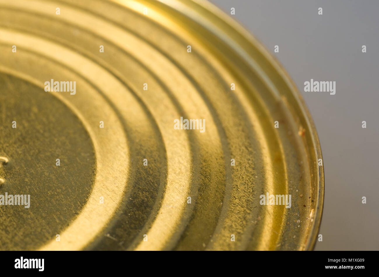 a lid or Base of Food yellow tin cans, macro, close up Stock Photo - Alamy