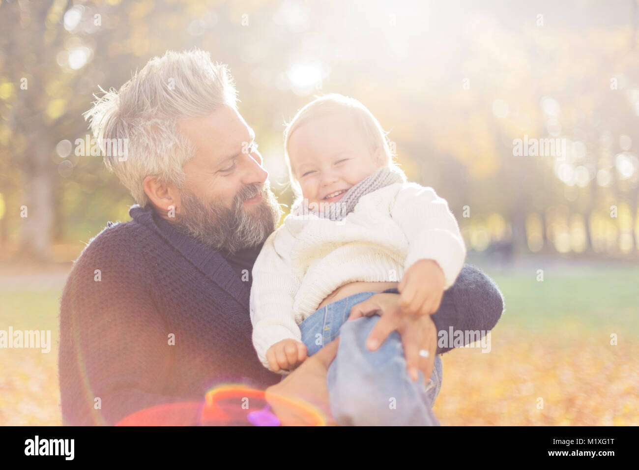 Father carrying son in Sweden Stock Photo - Alamy