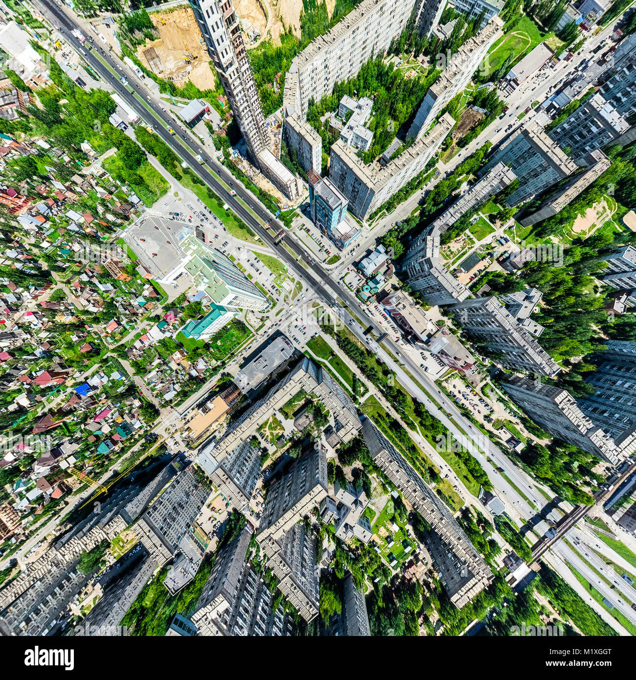 Aerial city view with crossroads and roads, houses, buildings, parks ...