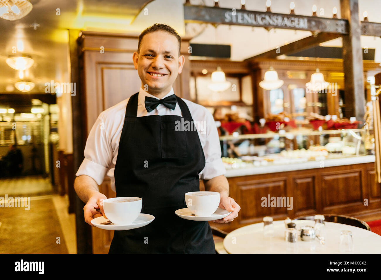 Waiter at bakery in Sweden Stock Photo - Alamy